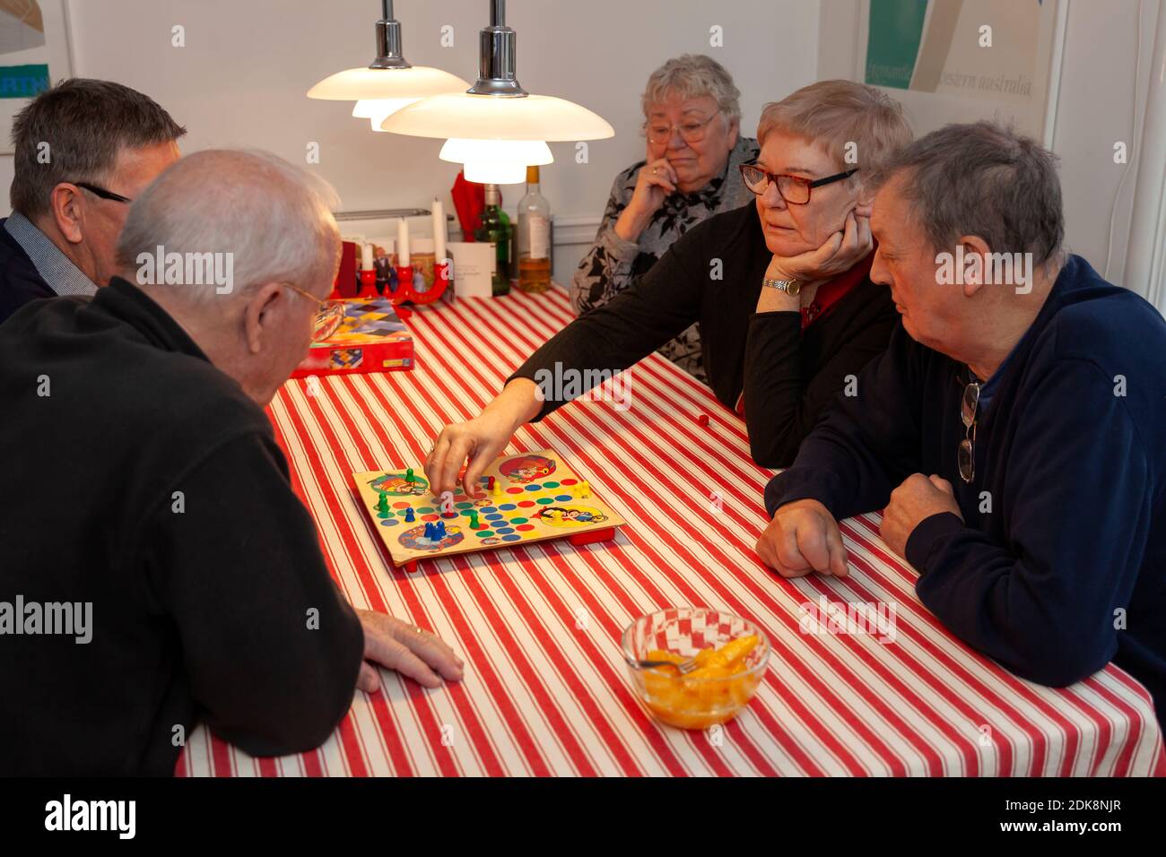 Senior people playing board game Stock Photo - Alamy