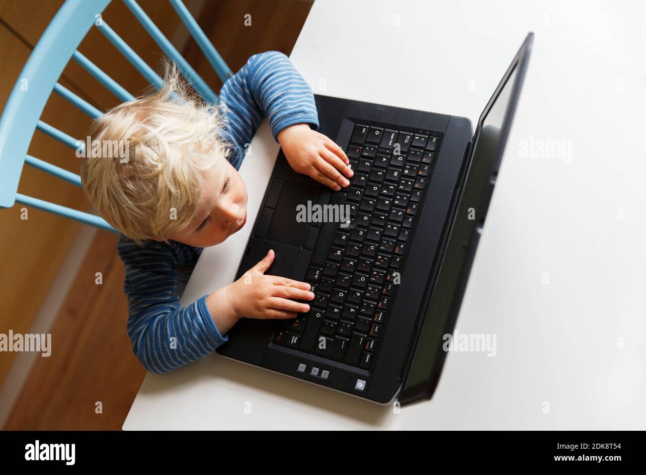 Boy using laptop Stock Photo - Alamy