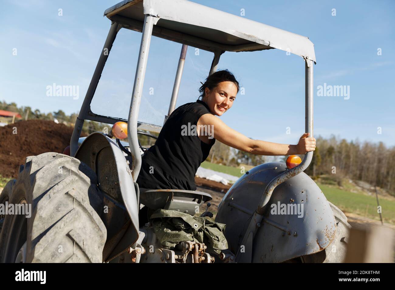 Woman driving tractor hi-res stock photography and images - Alamy