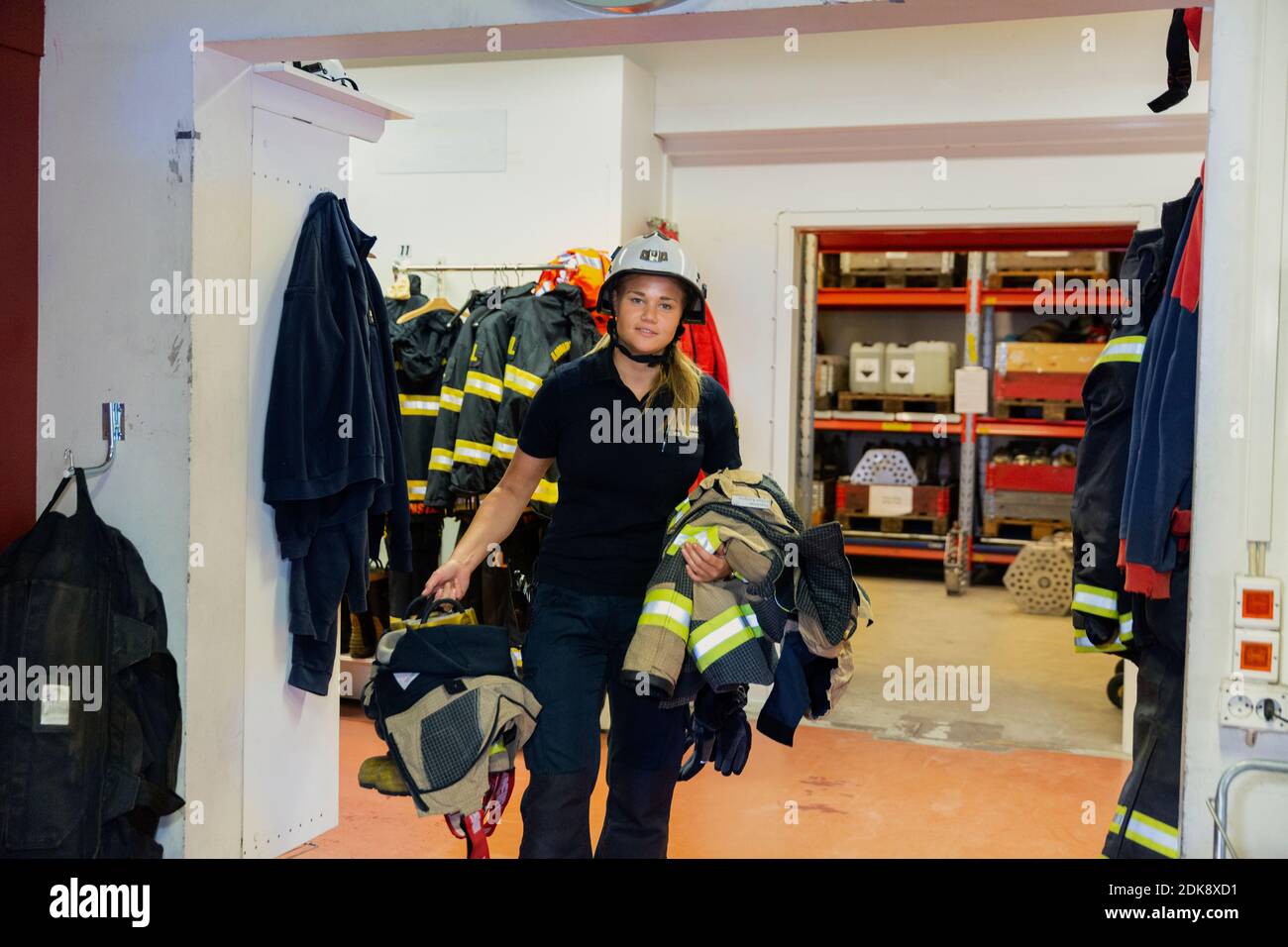 Female firefighter in fire station Stock Photo - Alamy