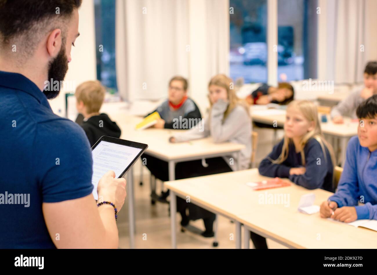 Teacher in front of class Stock Photo - Alamy