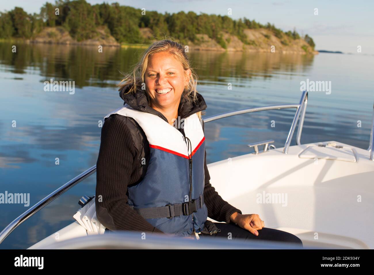 Smiling blonde boat hi-res stock photography and images - Alamy
