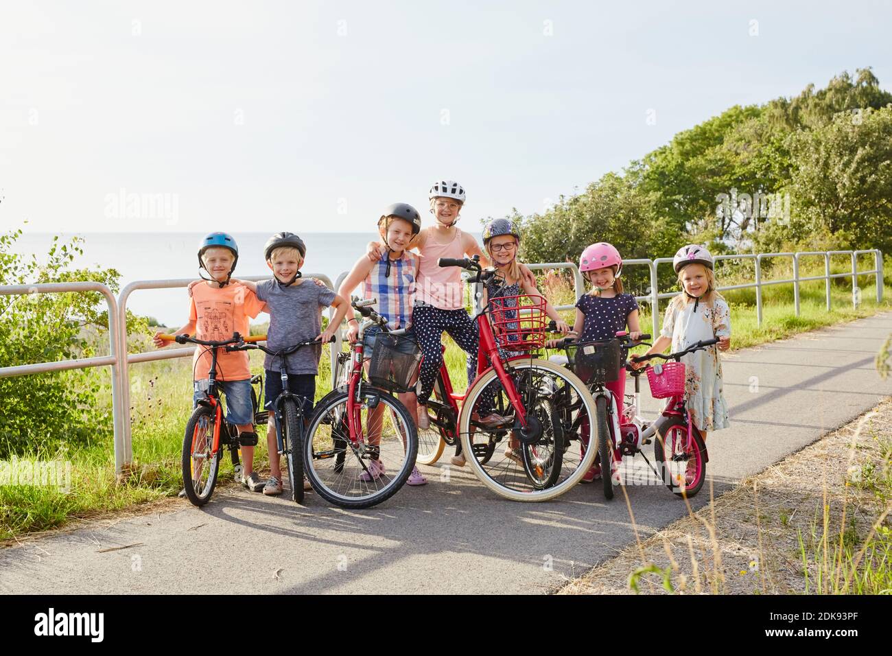 Children standing with bicycles Stock Photo - Alamy