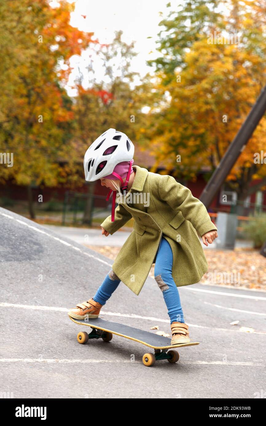 Girl skateboarding at autumn Stock Photo - Alamy