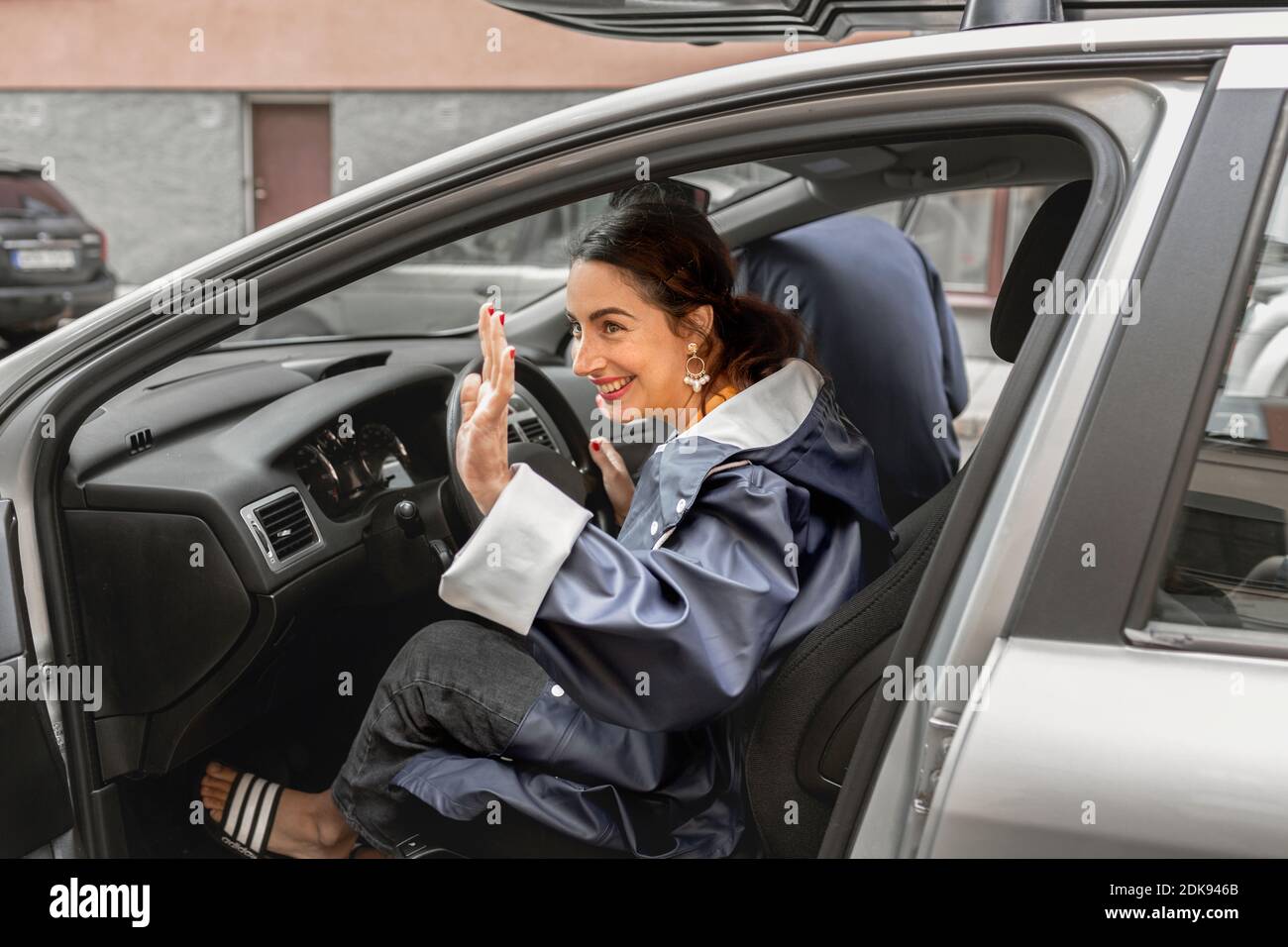Smiling woman in car Stock Photo - Alamy