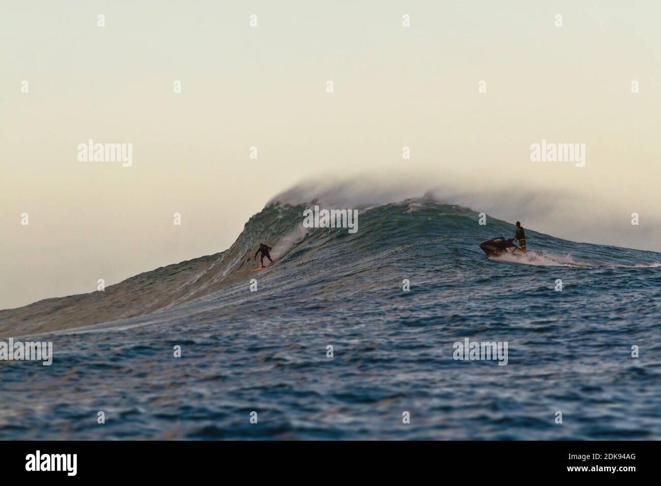 Big Wave Tow In Surfers Stock Photo - Alamy