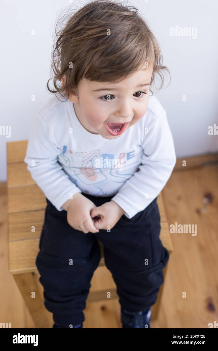 Boy Sitting On Stool High Resolution Stock Photography and Images - Alamy