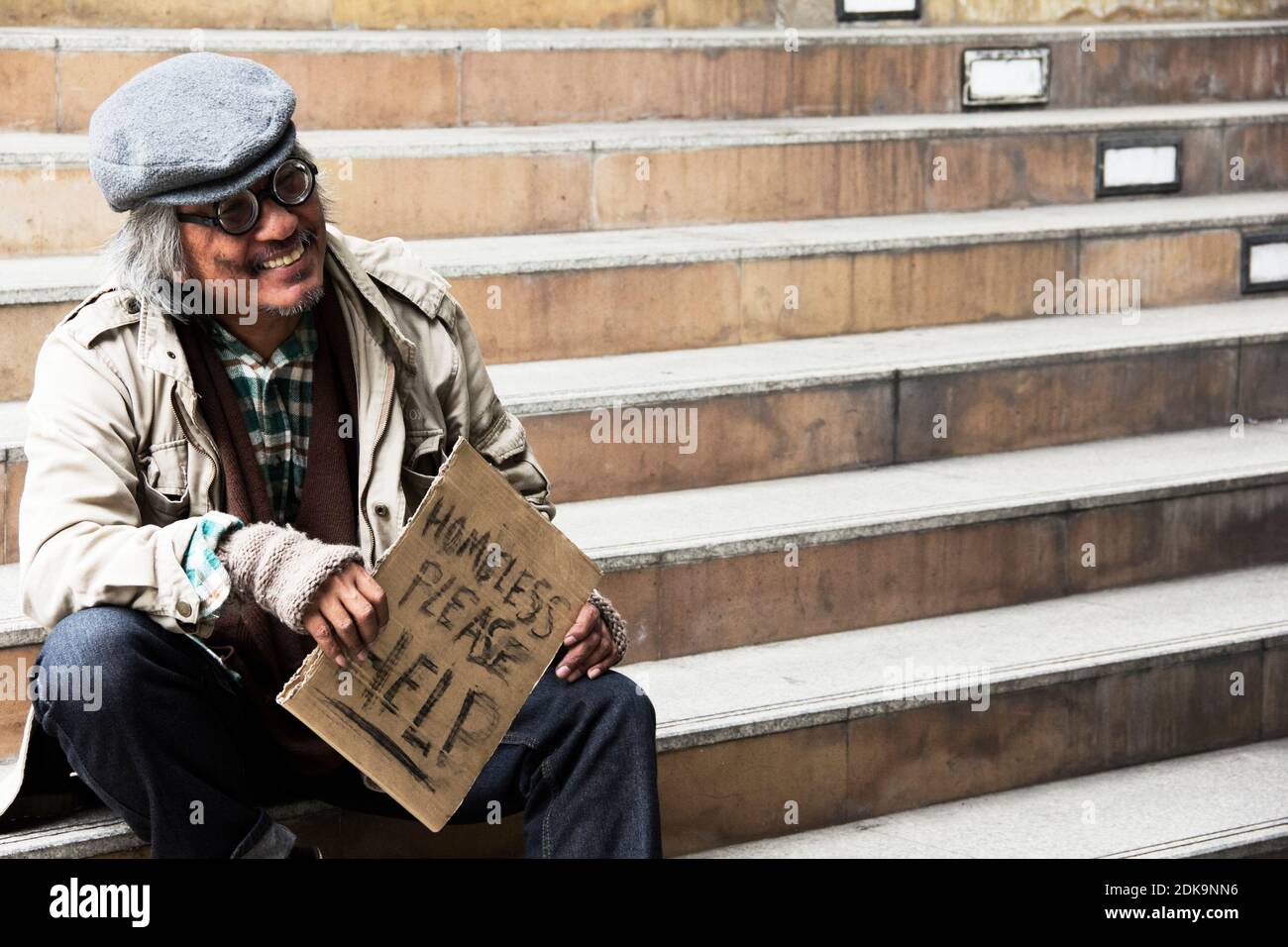 Smiling beggar hi-res stock photography and images - Alamy