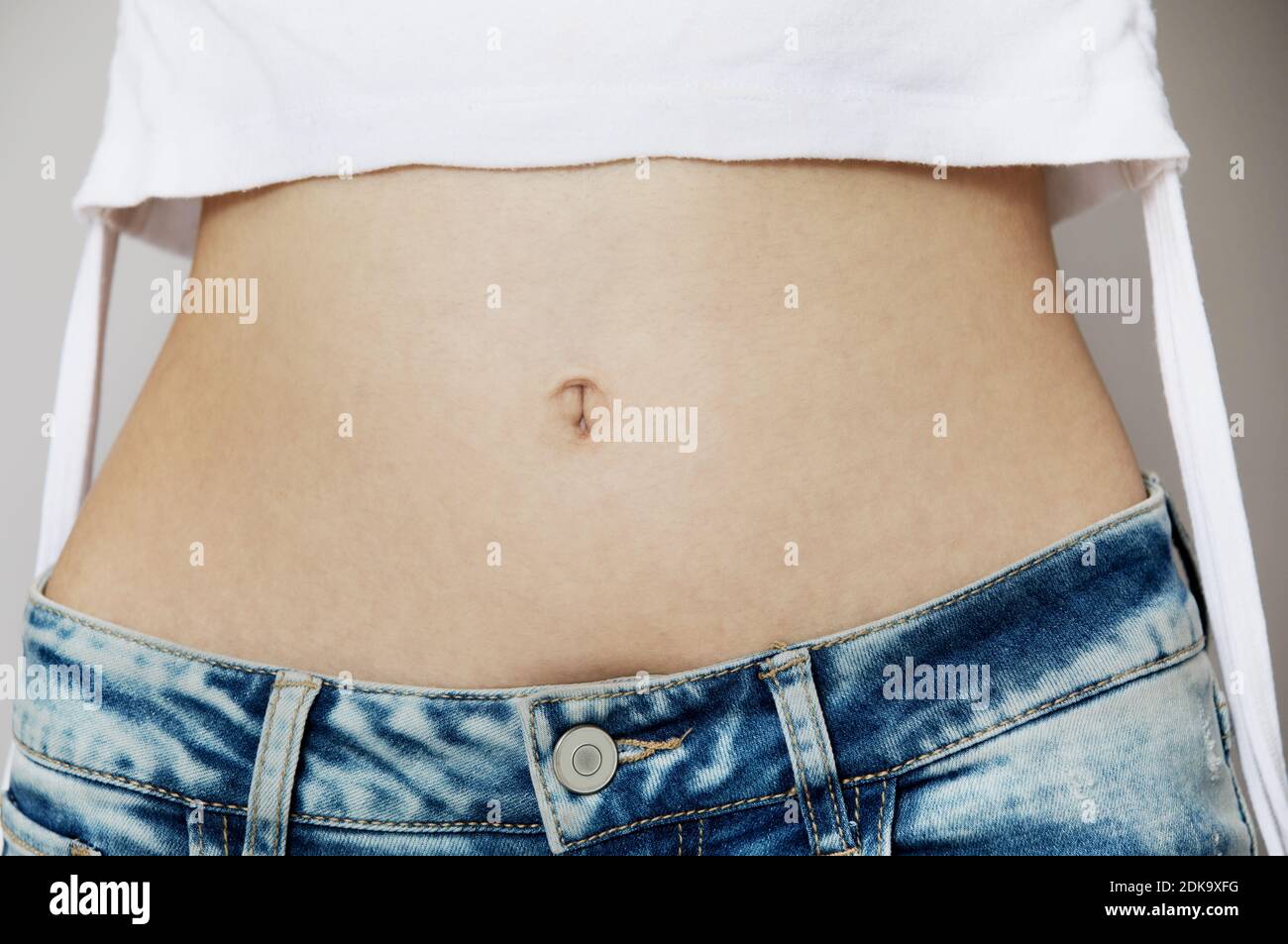 Woman Belly Button Jeans High Resolution Stock Photography and Images ...