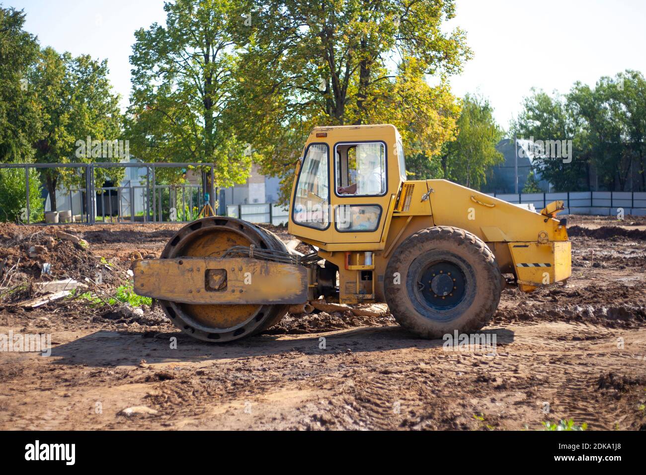 Bulldozer at a construction site. Heavy construction equipment. Sand ...