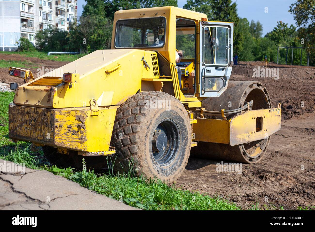 Bulldozer at a construction site. Heavy construction equipment. Sand ...