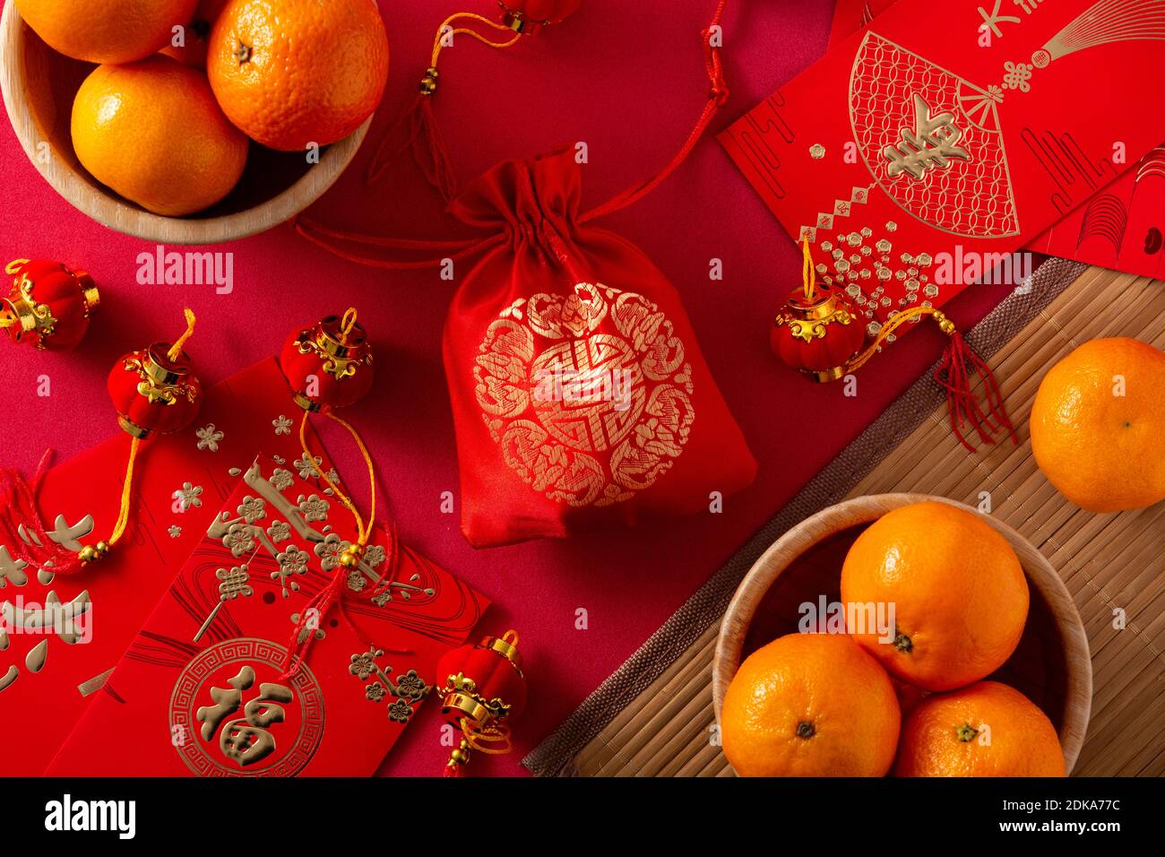 Chinese new year festival decorations and oranges on red background ...