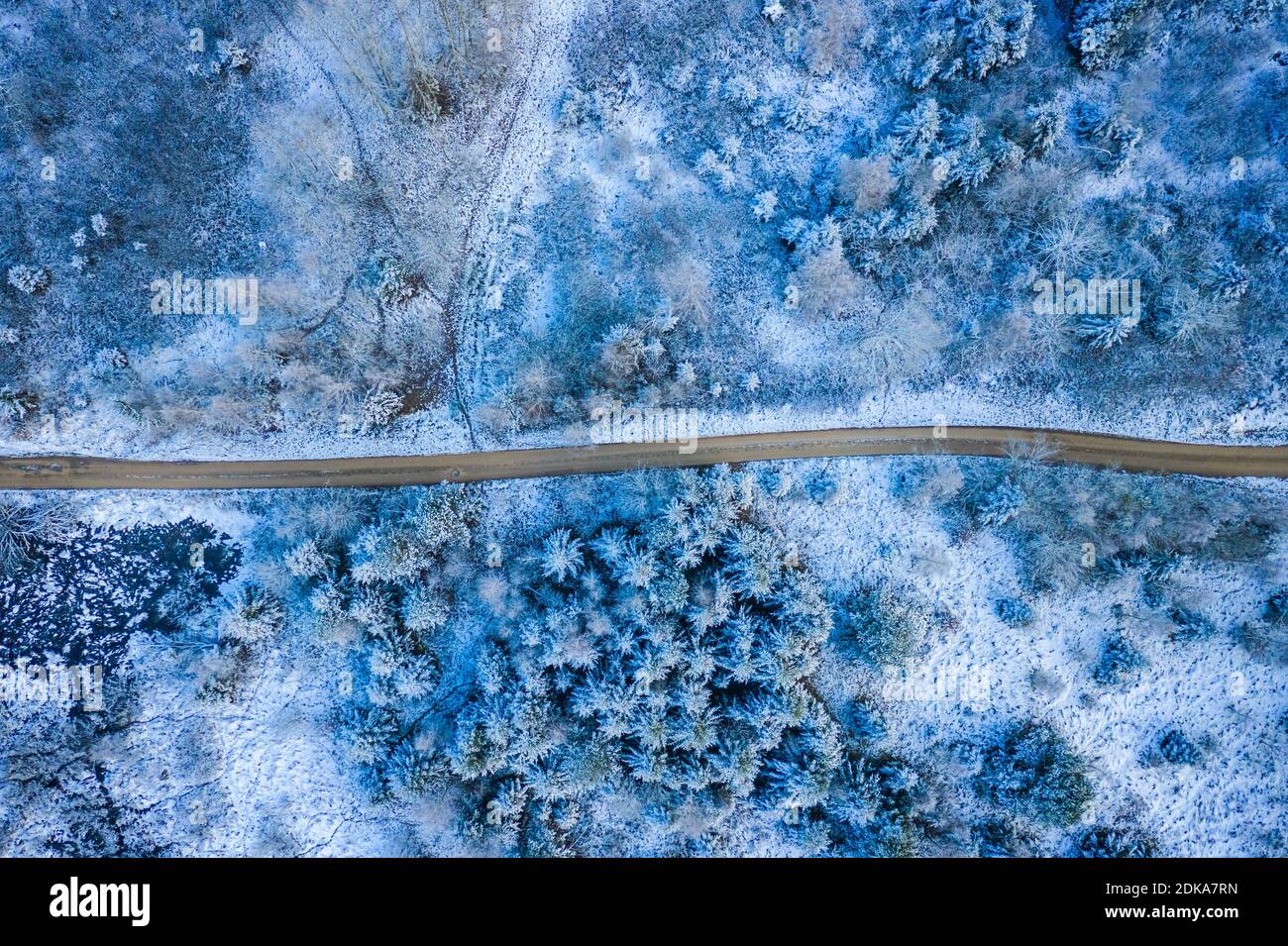Windy winter road in snow covered forest, top down aerial view Stock ...