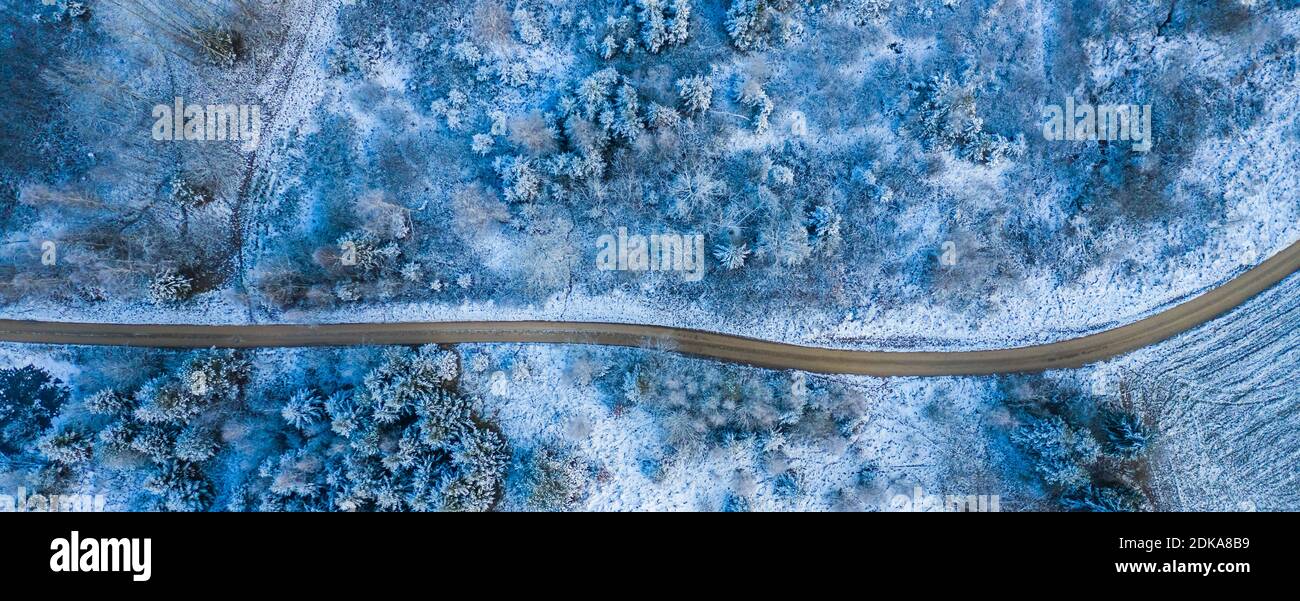 Windy winter road in snow covered forest, top down aerial view Stock ...