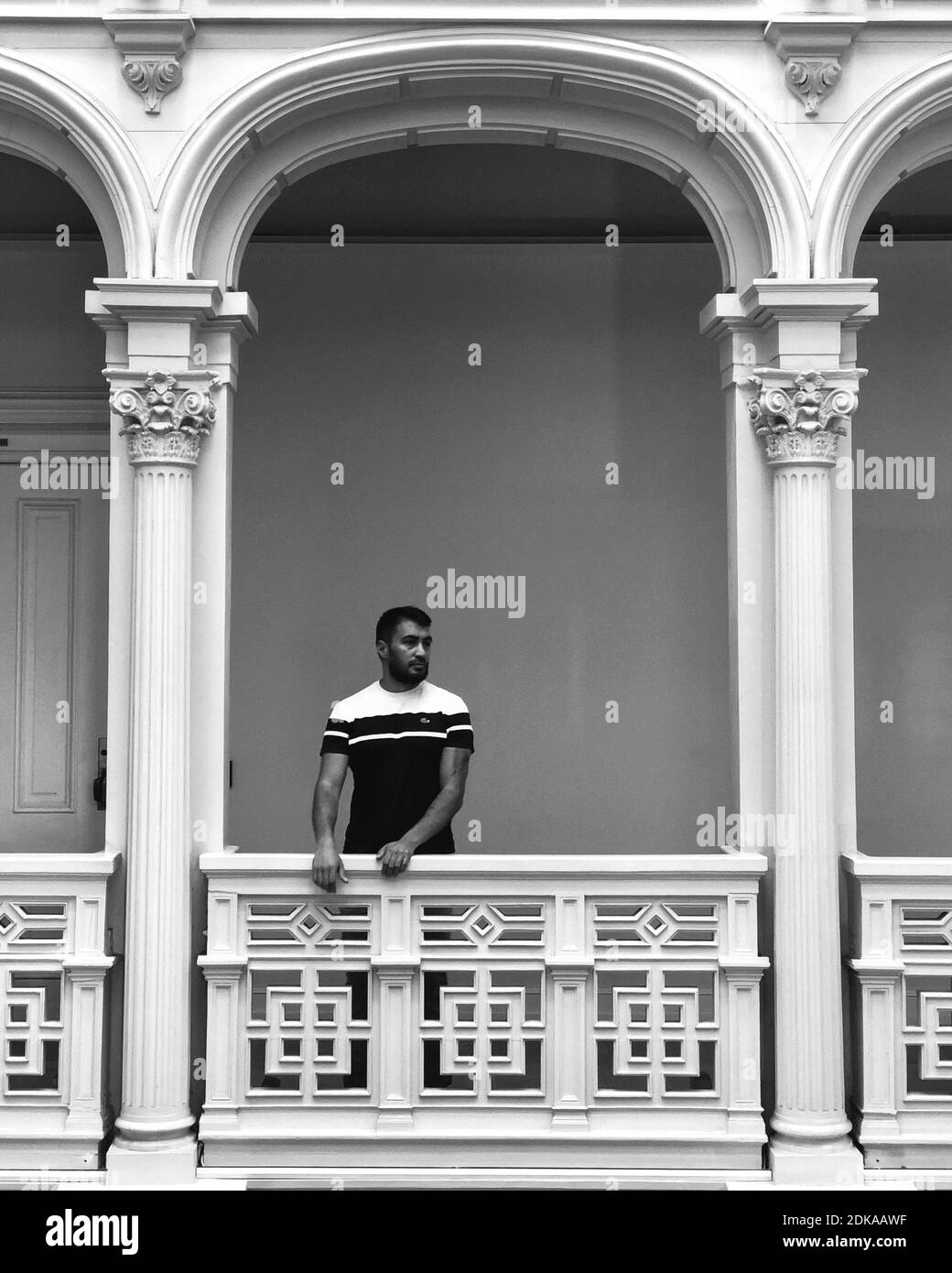 Man standing balcony balcony Black and White Stock Photos & Images - Alamy