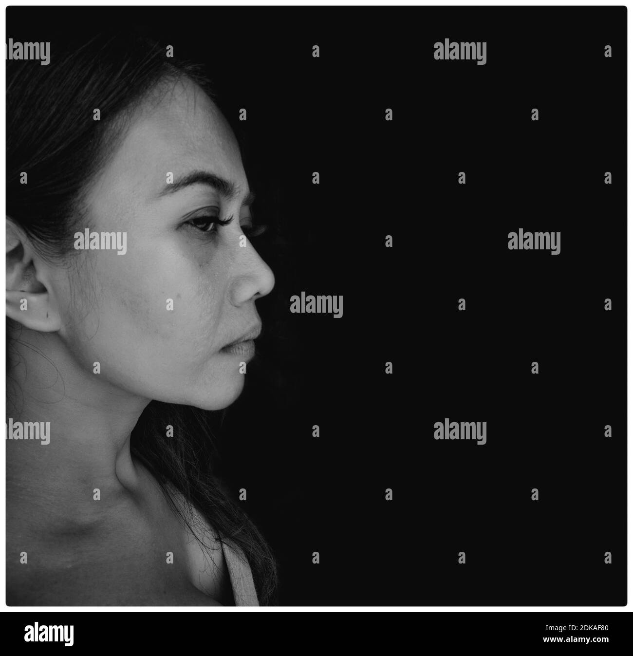 Asian woman looking up side profile Cut Out Stock Images & Pictures - Alamy