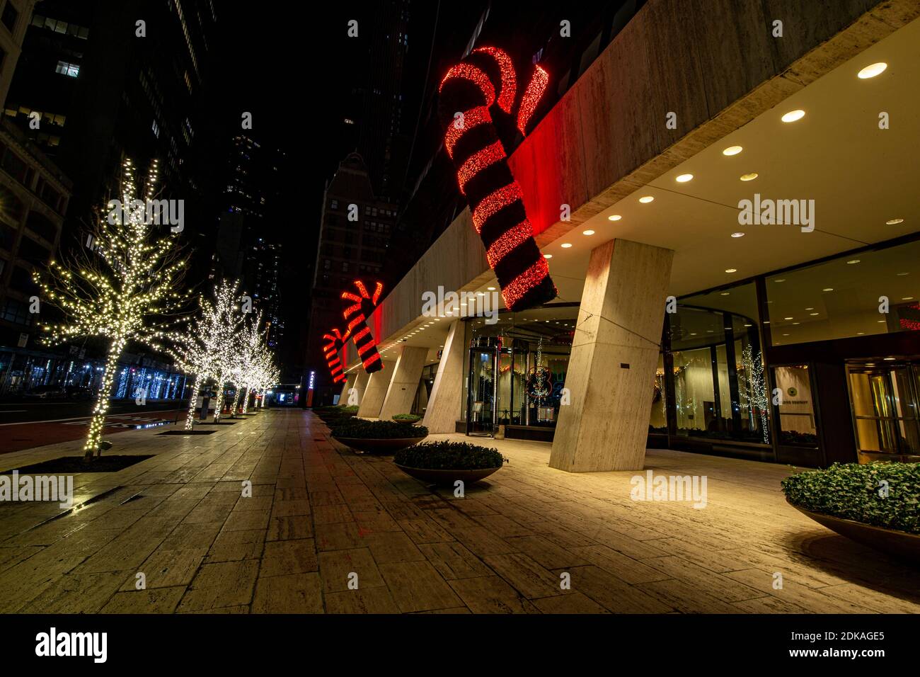 Giant candy canes hang outside an office building on W. 57th St. in New ...