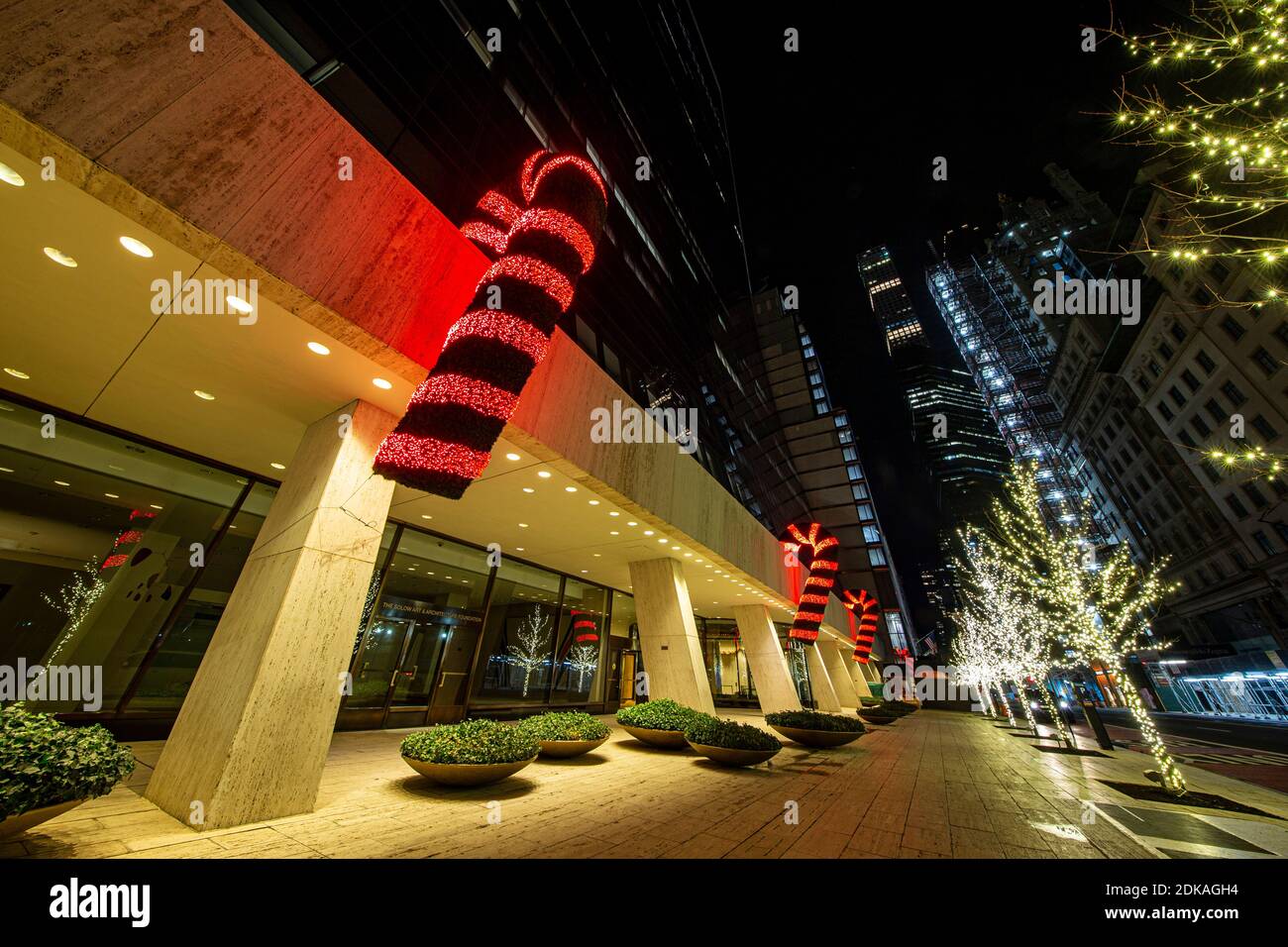 Giant candy canes hang outside an office building on W. 57th St. in New ...