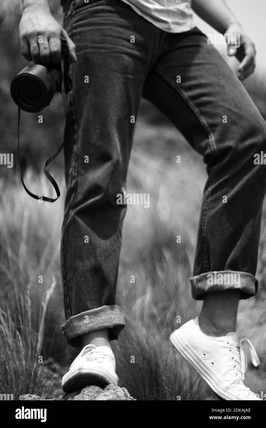 Young man standing one leg Black and White Stock Photos & Images - Alamy