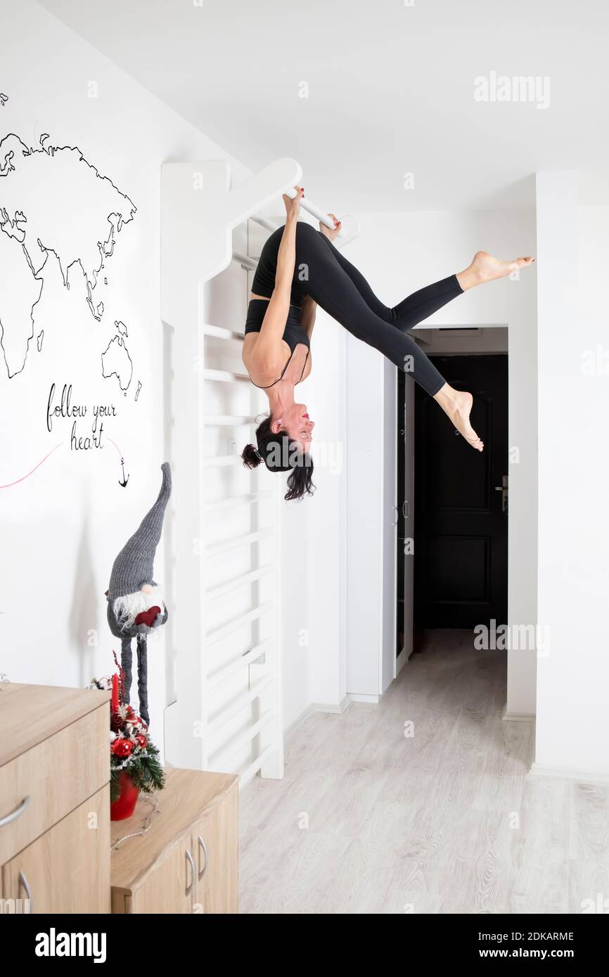 Woman hanging upside down hi-res stock photography and images - Alamy