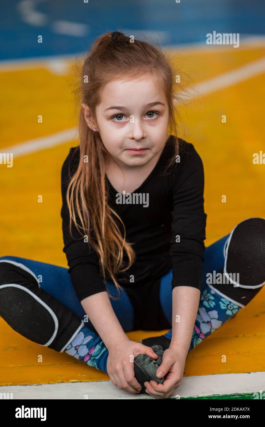 little girl doing gymnastics. little gymnast girl in gym. Girl gymnast ...