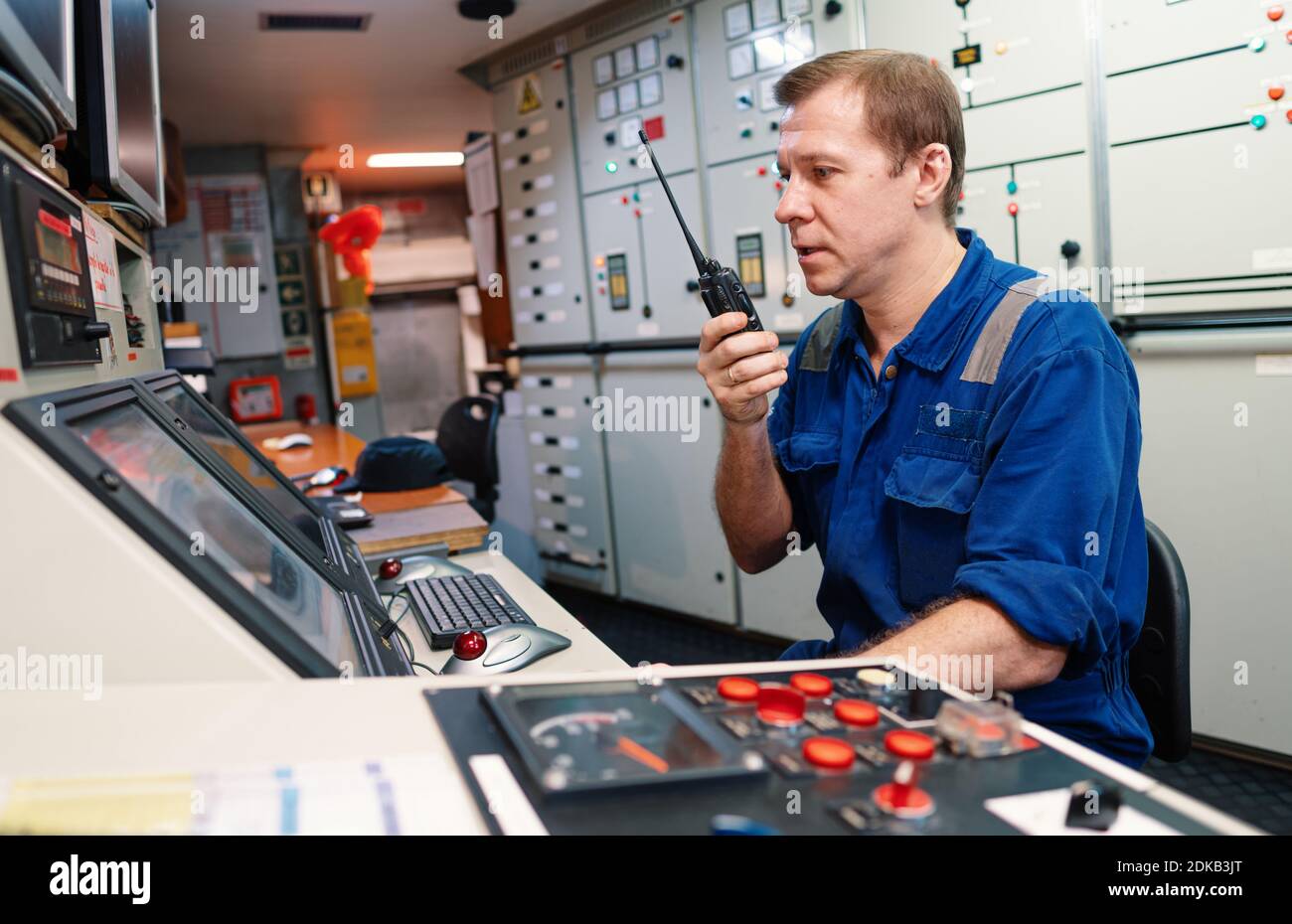 Marine engineer officer controlling vessel engines and propulsion in ...