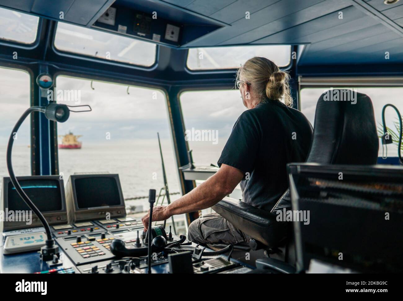 Captain of deck Officer on bridge of vessel or ship during navigaton ...