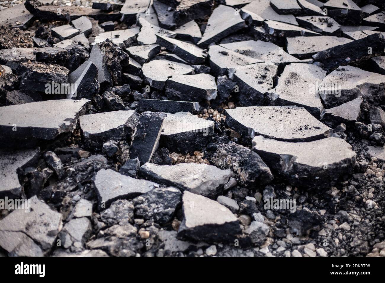 Broken asphalt. Repair pavement in the city. Highway after heavy ...