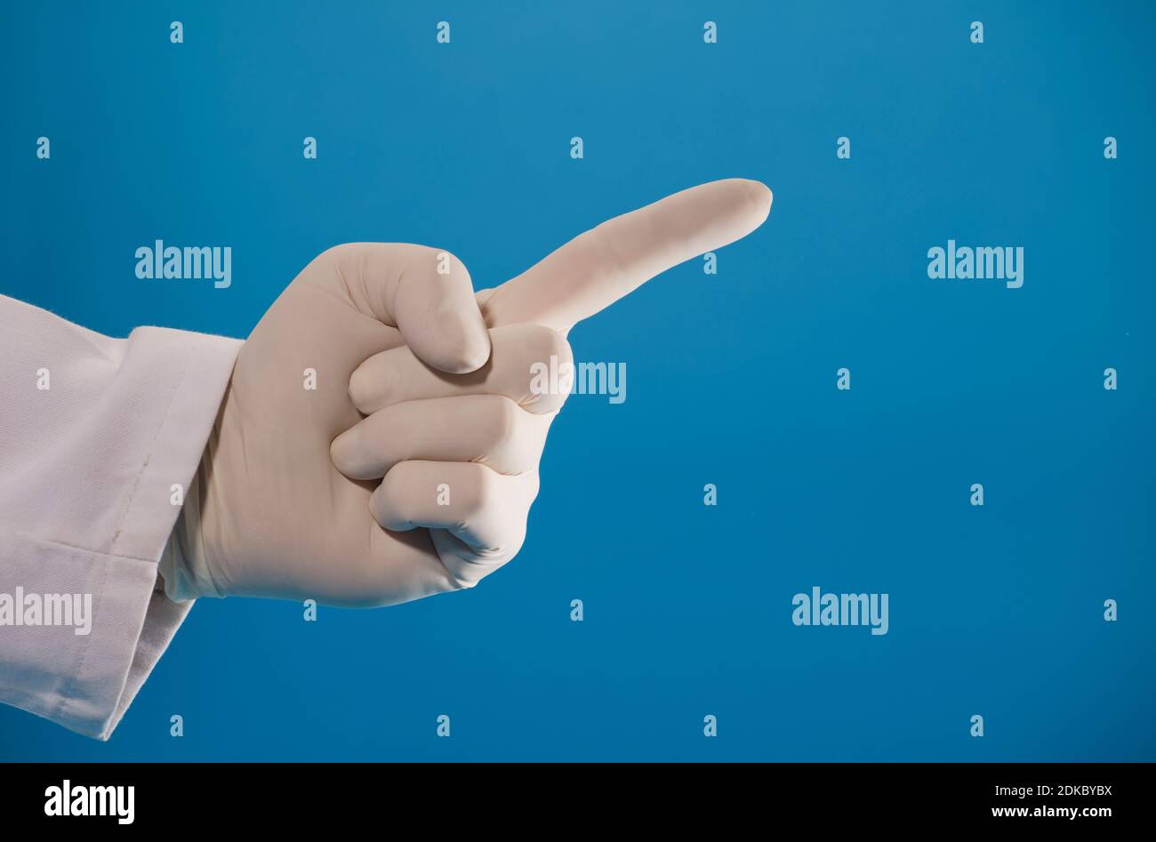 warning gesture doctor hand with surgical glove and blue background ...