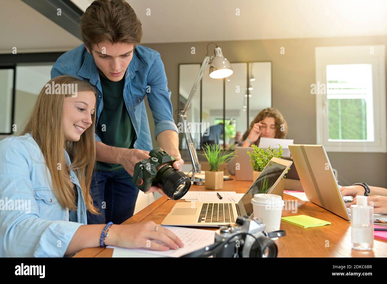 Students in photography working together on project Stock Photo - Alamy