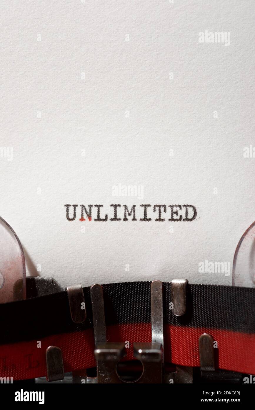 Unlimited word written with a typewriter Stock Photo - Alamy