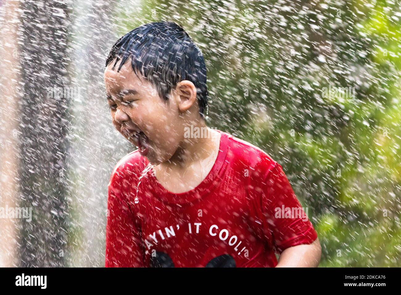 Boy enjoying rain hi-res stock photography and images - Alamy