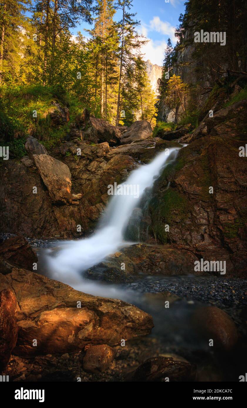 Waterfall in the swiss alps with long exposure Stock Photo - Alamy