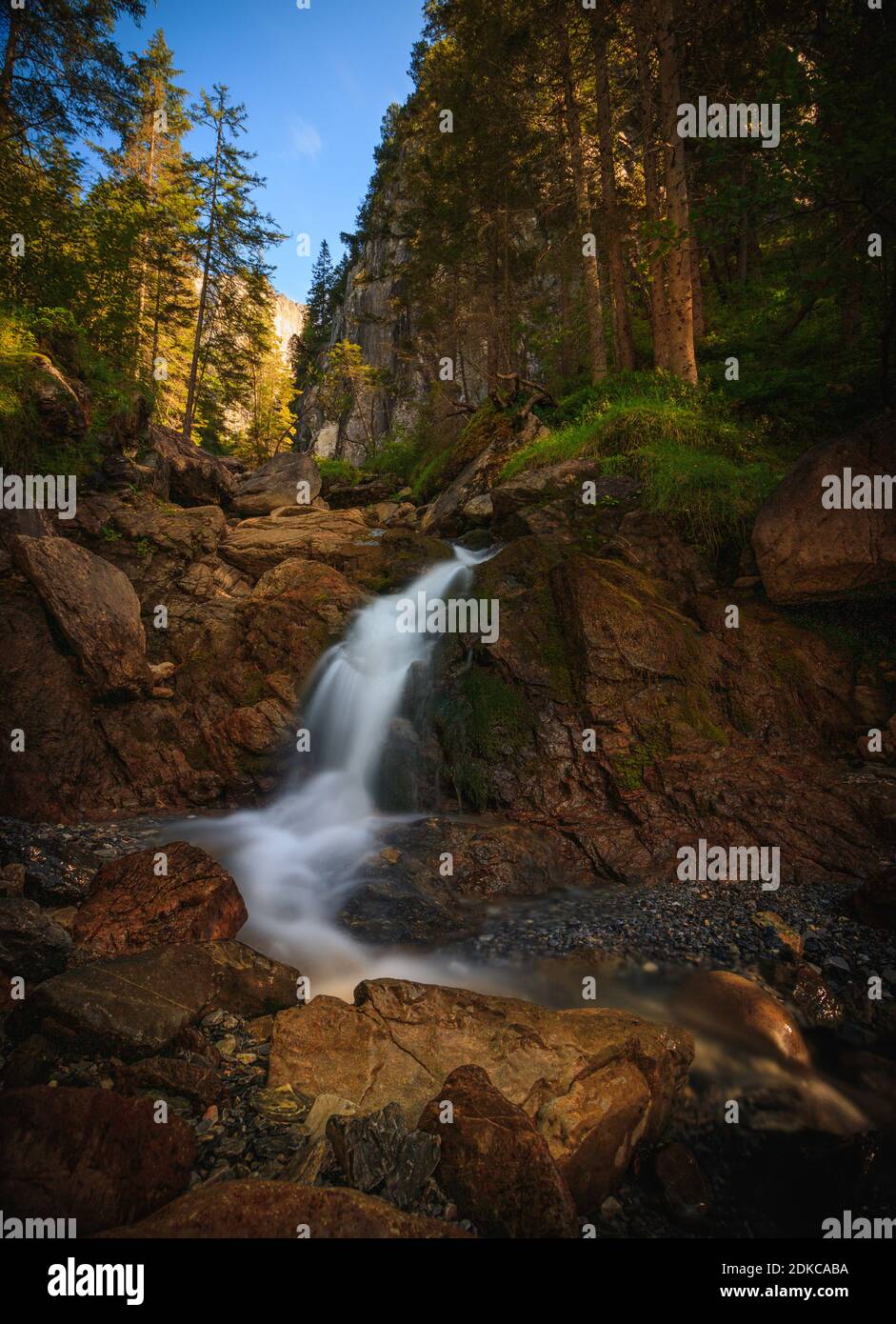Waterfall in the swiss alps with long exposure Stock Photo - Alamy