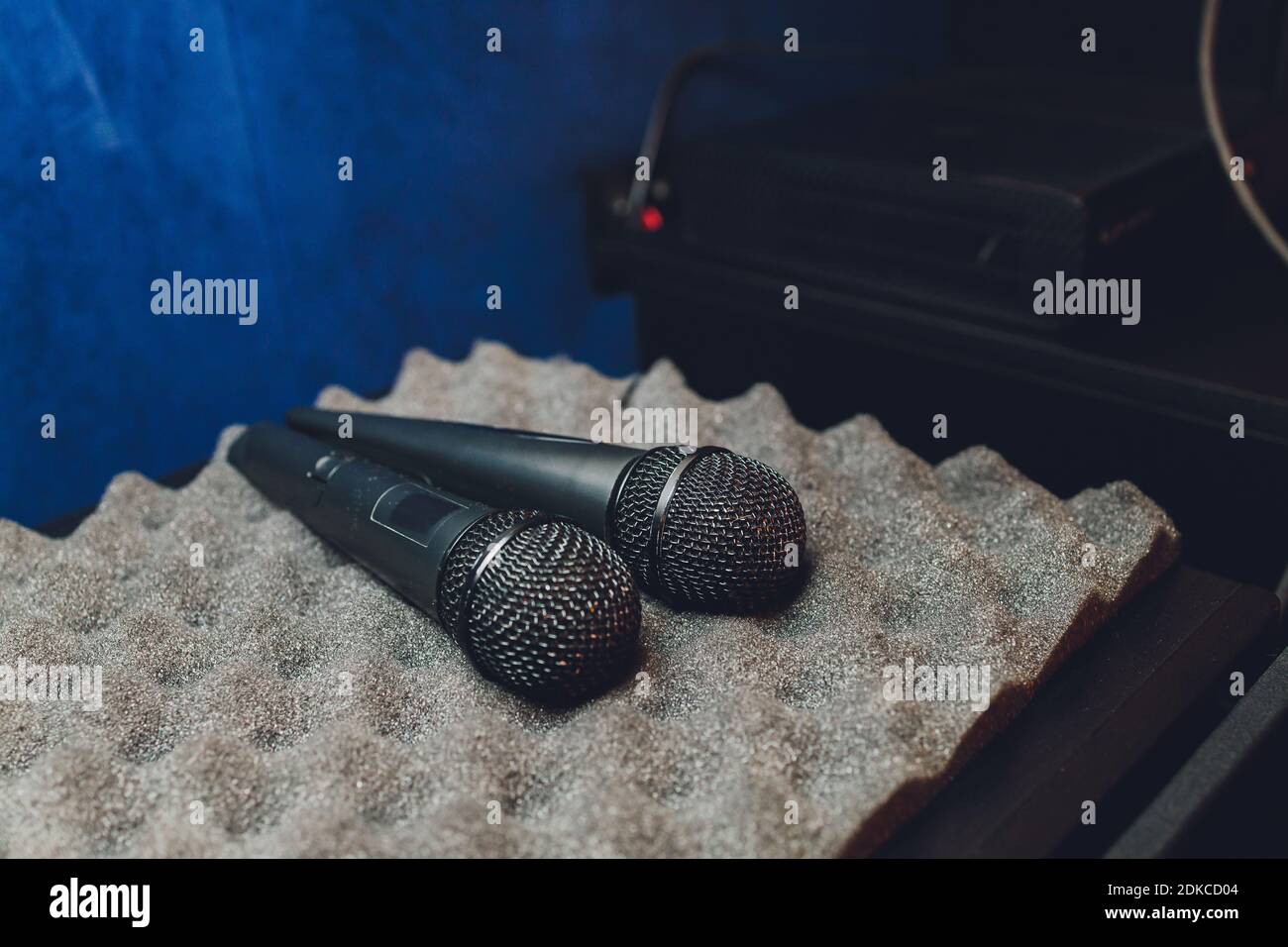 Two silver microphones isolated over white background . Two wireless ...