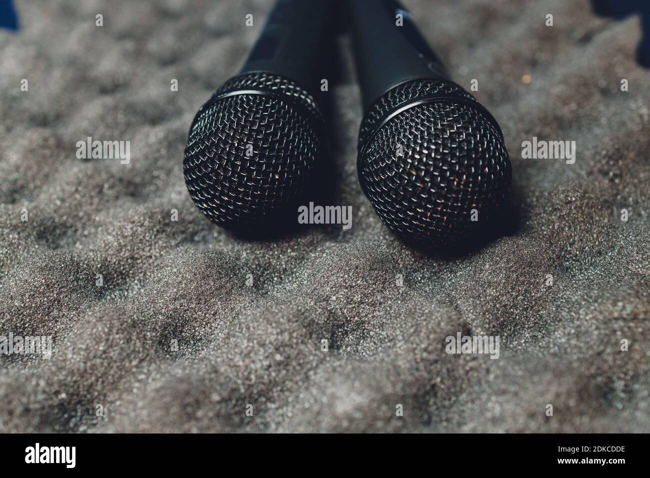 Two silver microphones isolated over white background . Two wireless ...