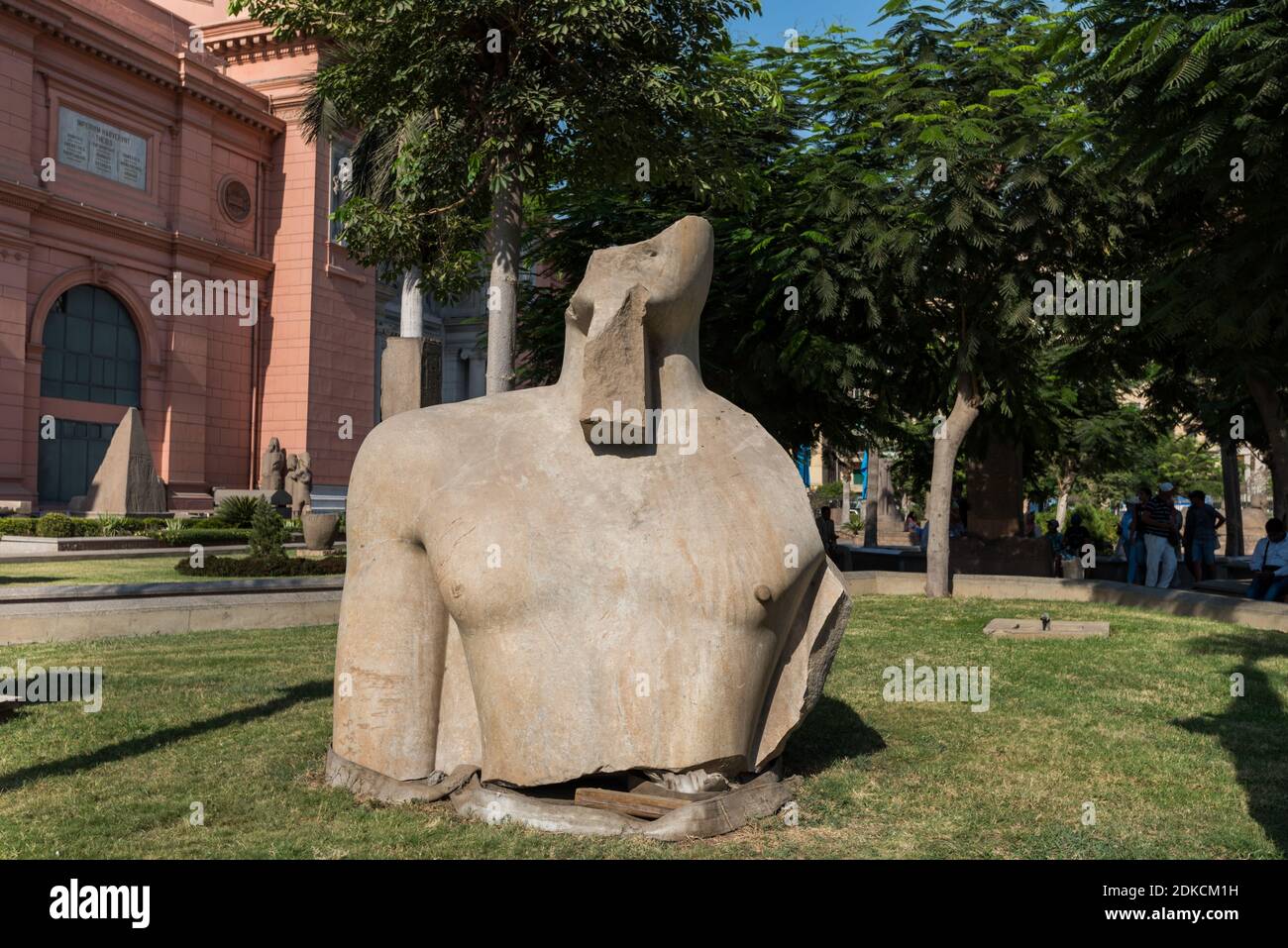 A damaged rock sculpture in the lawn of the Museum of Egyptian ...