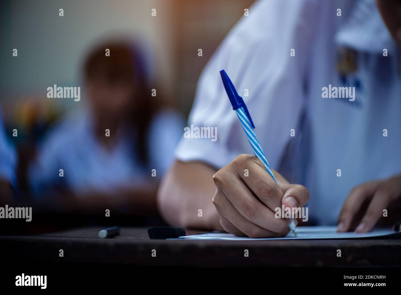 Students taking exam with stress in school classroom Stock Photo - Alamy