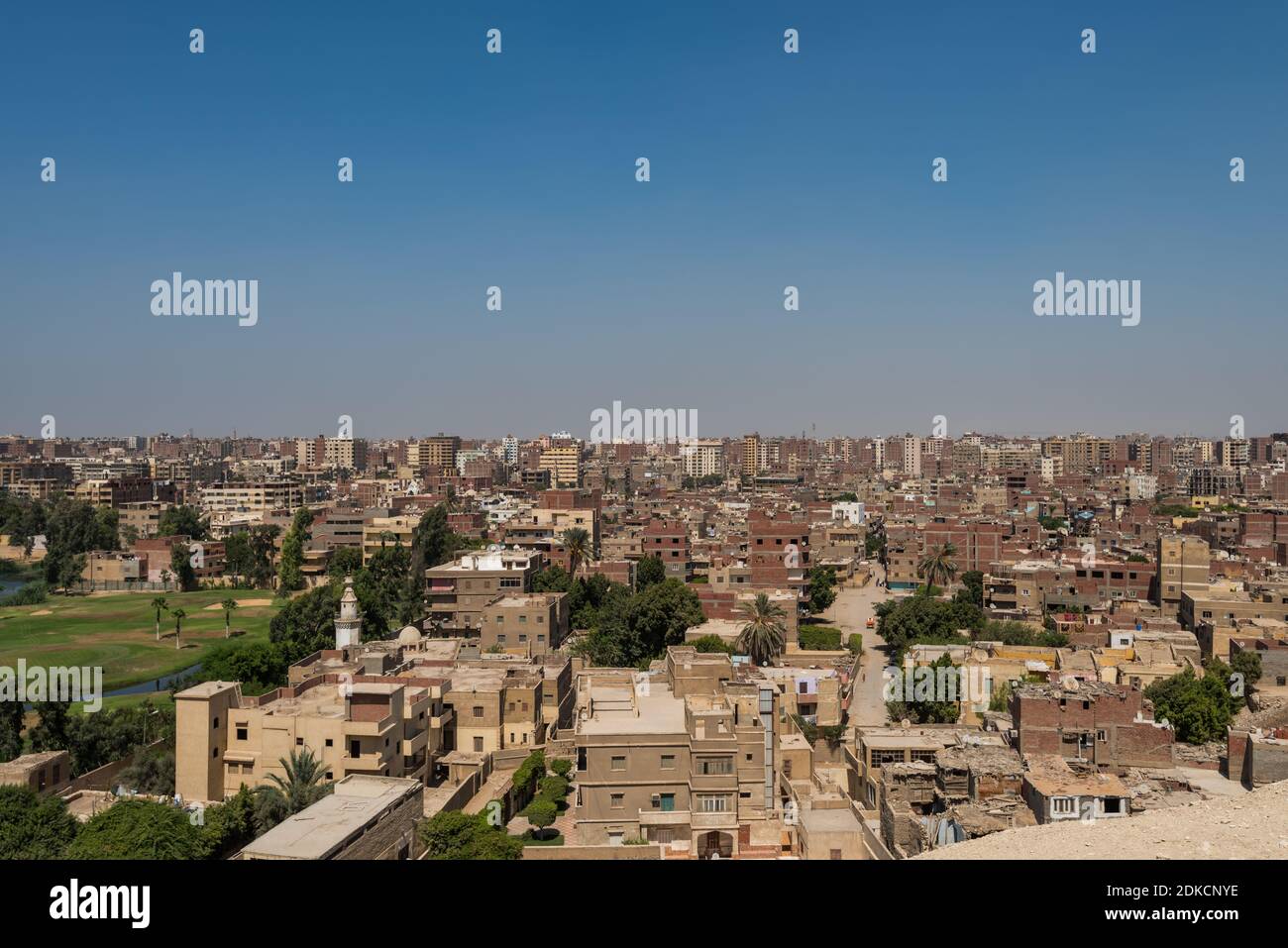 Aerial view of Cairo of red brick houses from the Giza pyramid complex ...