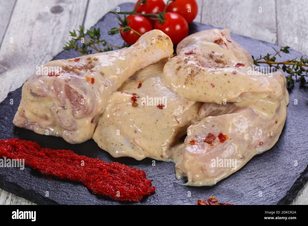 Marinated chicken parts ready for roast Stock Photo - Alamy