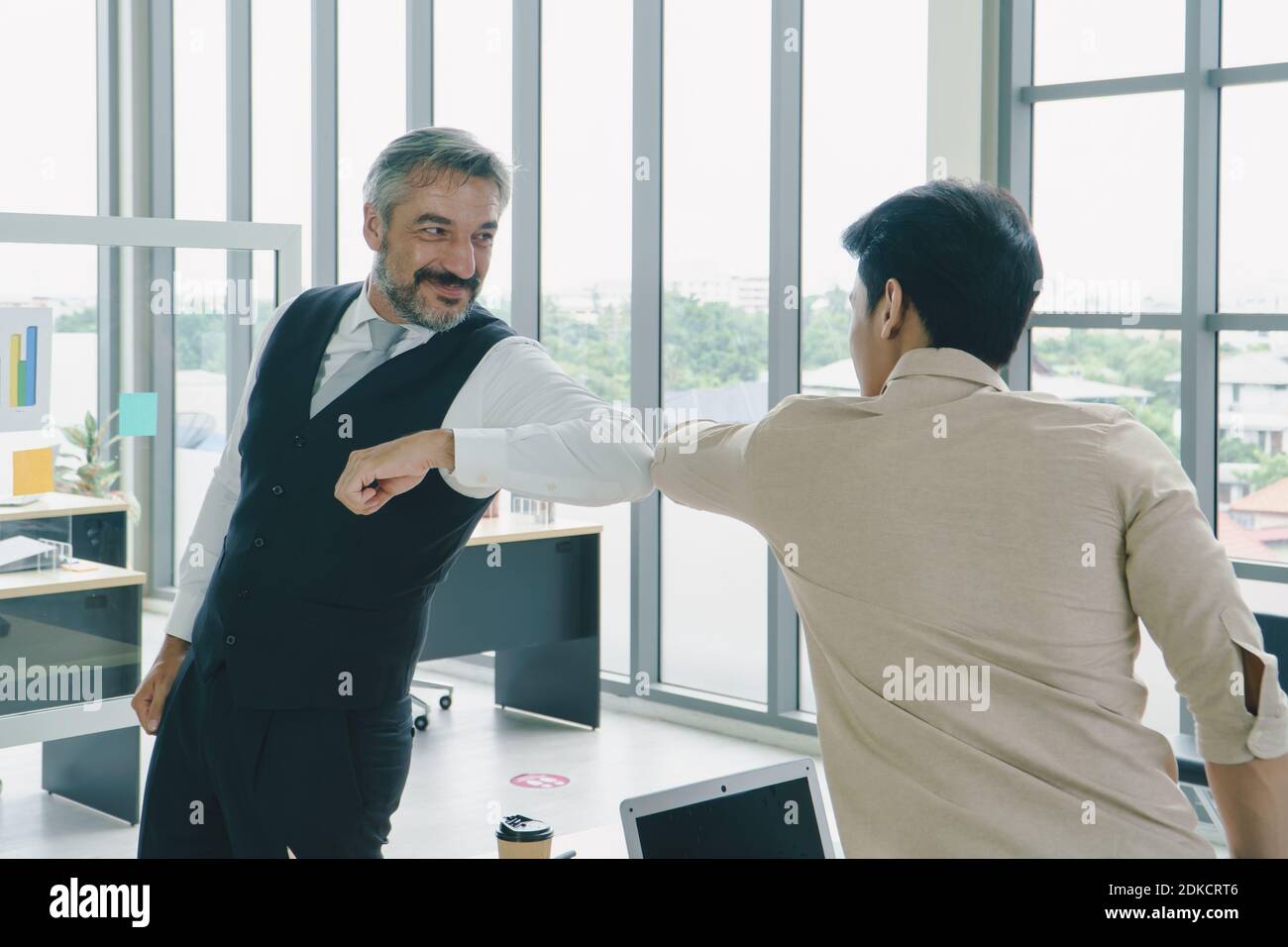 Businessman standing window looking distance hi-res stock photography ...