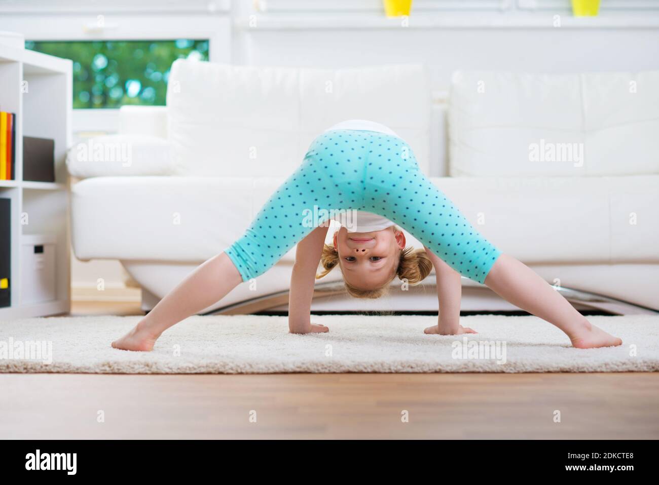 Full Length Of Cute Girl Exercising At Home Stock Photo - Alamy