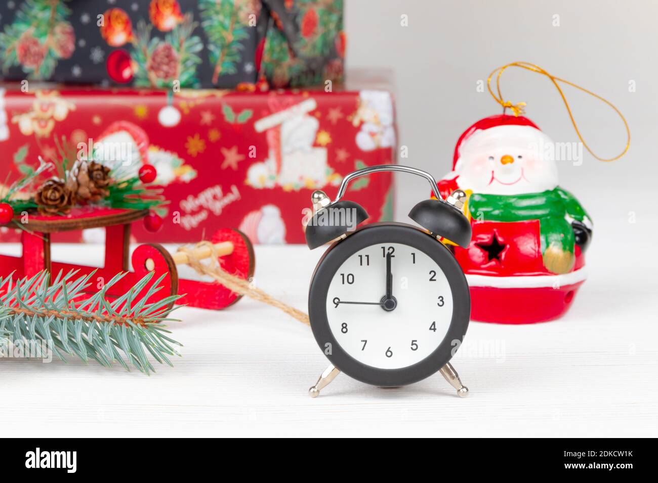 santa claus sleigh, gift boxes, spruce branch, alarm clock and snowman ...