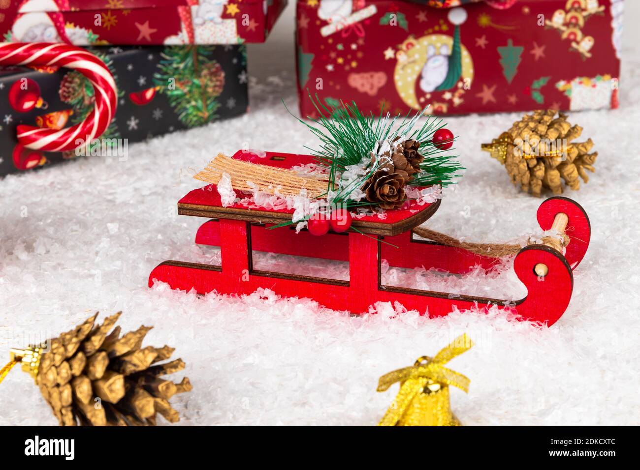 sleigh of santa claus, boxes with gifts, christmas tree cone and golden ...