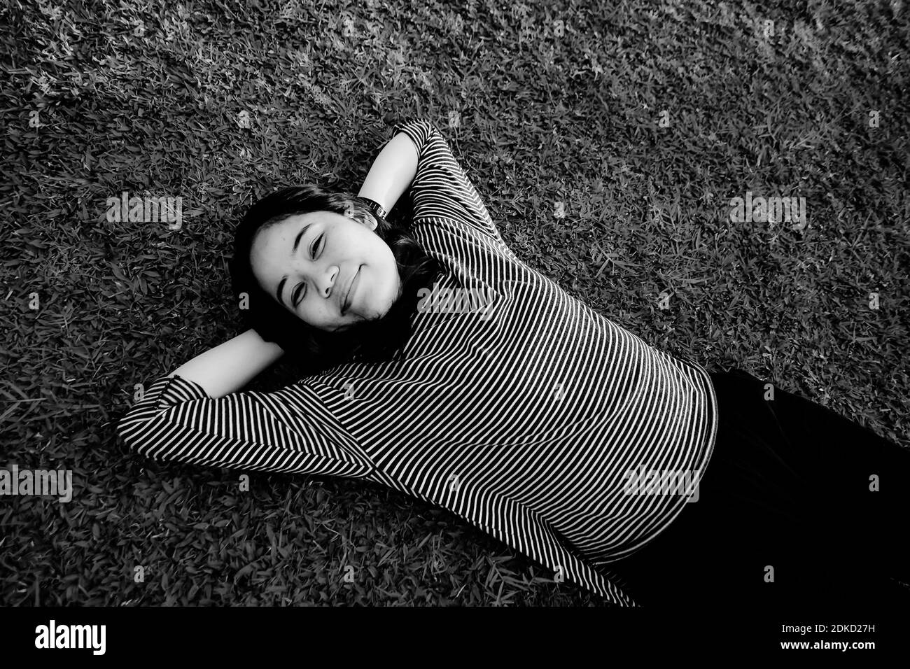 Woman lying on bed back view Black and White Stock Photos & Images - Alamy