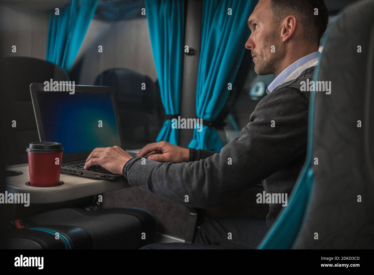 Man with laptop in bus hi-res stock photography and images - Alamy