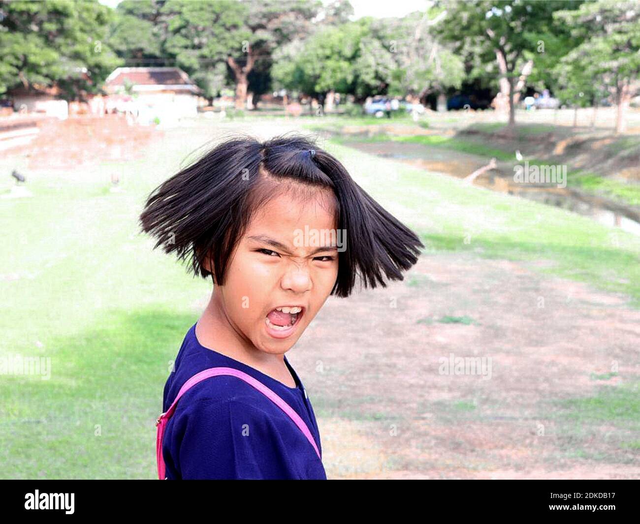 Short black hair angry girl hi-res stock photography and images - Alamy