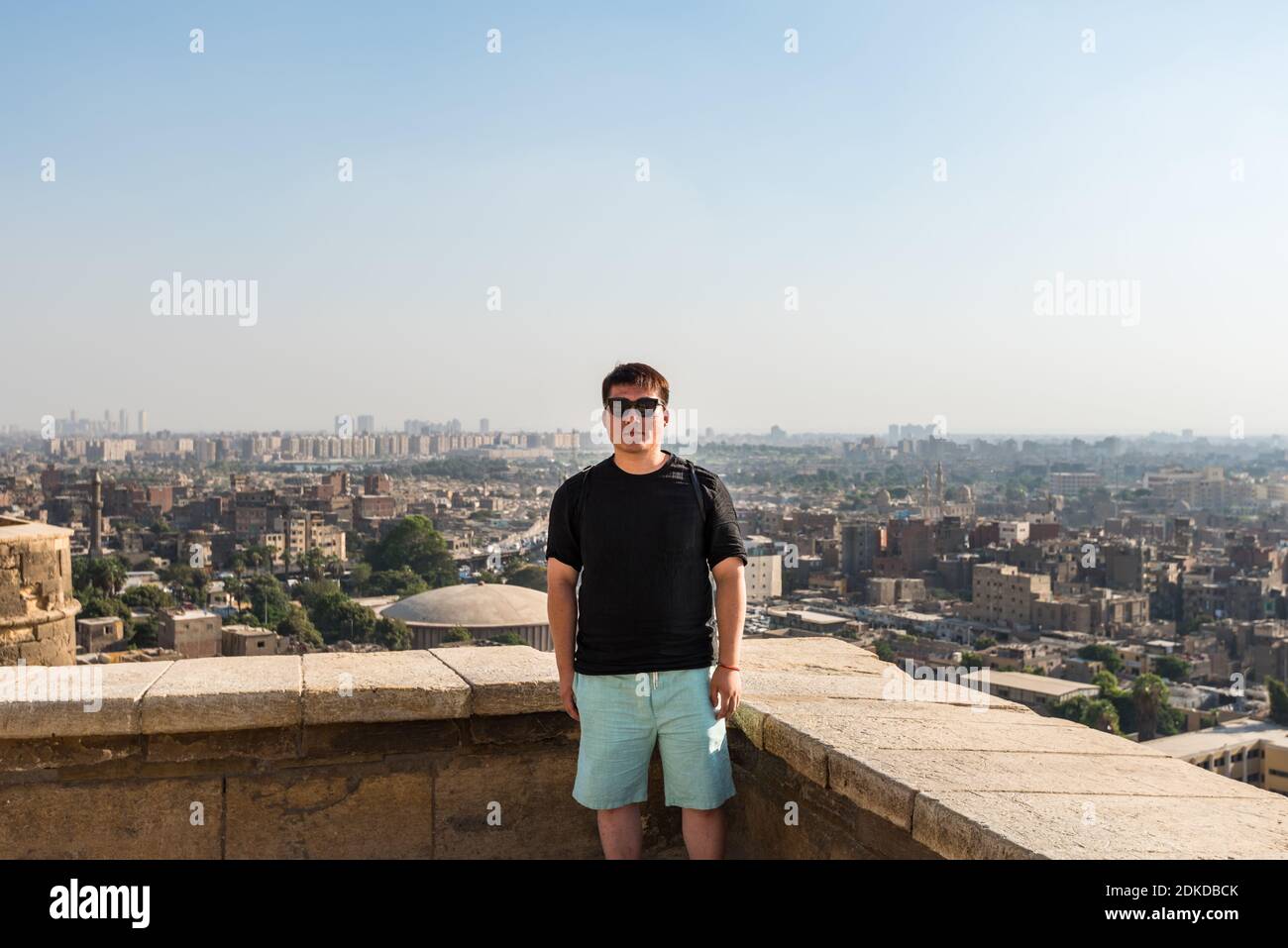 A Chinese tourist standing at the Saladin Citadel of Cairo and Aerial ...