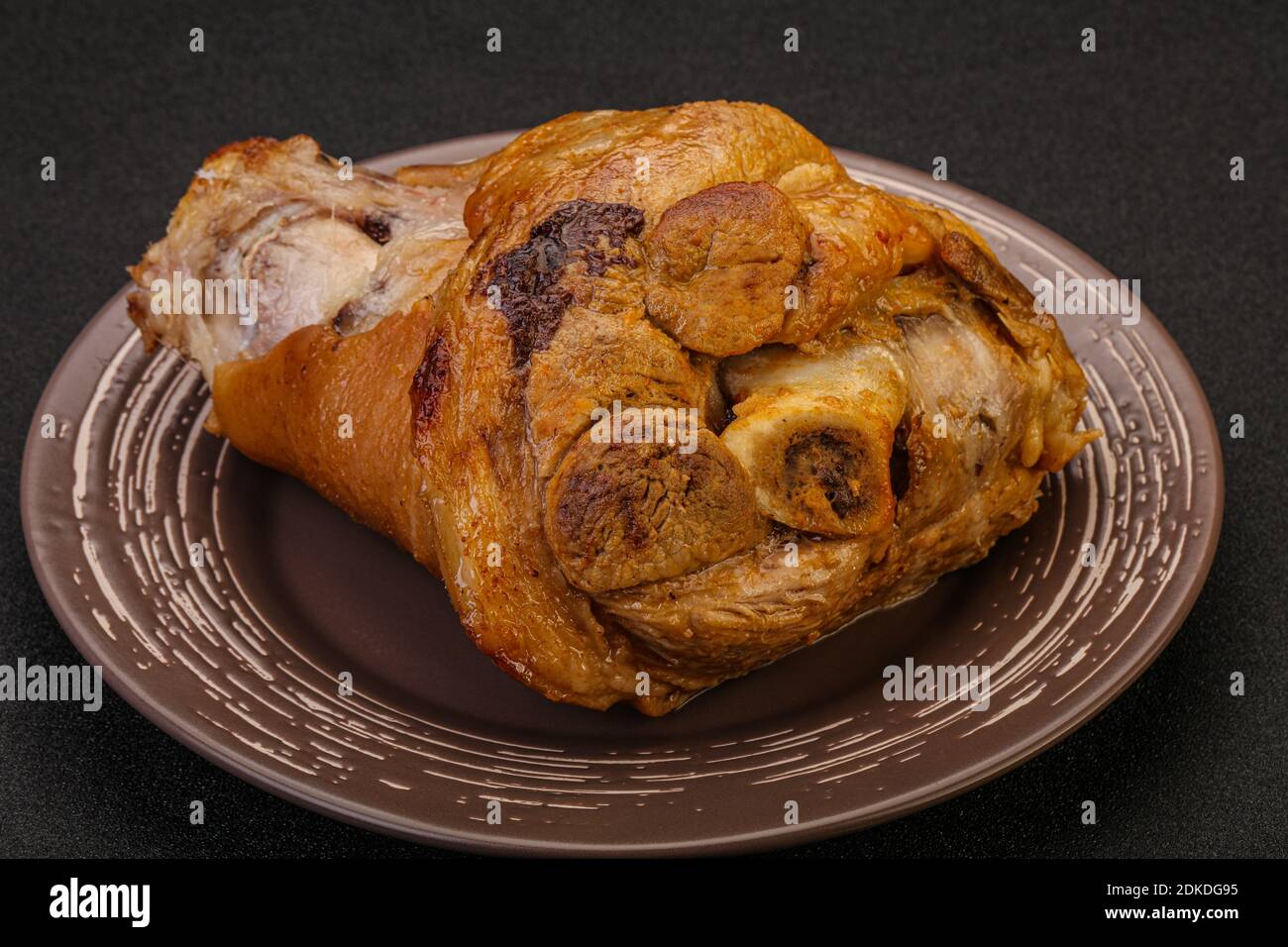 Baked pork knuckle with spices and herbs Stock Photo - Alamy