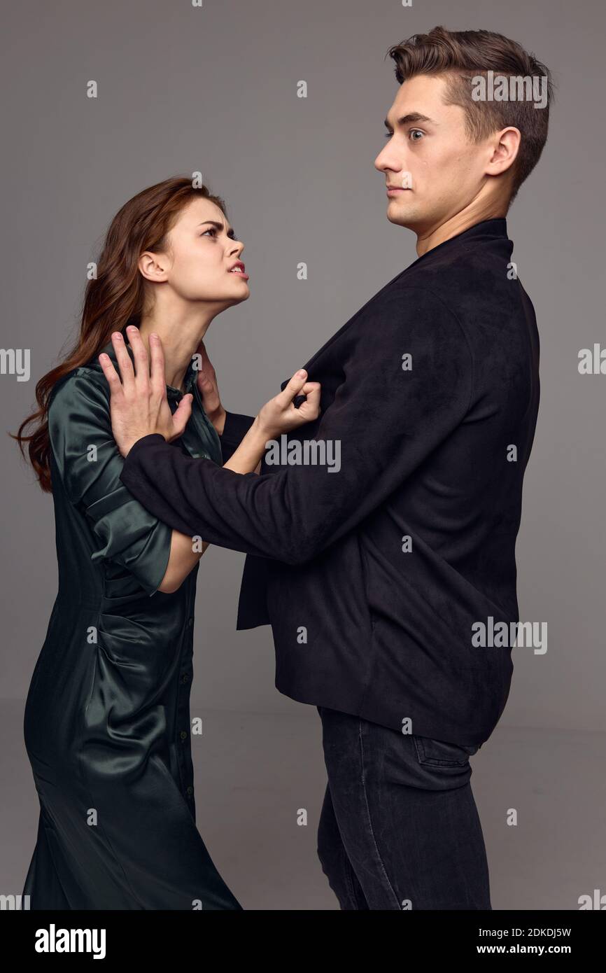 Aggressive woman indignant look at men problems in family conflict ...